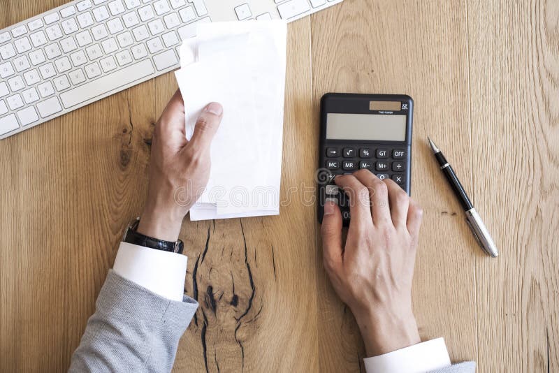 Hands Holding Bills and Paying Bills on Table Stock Photo - Image of ...