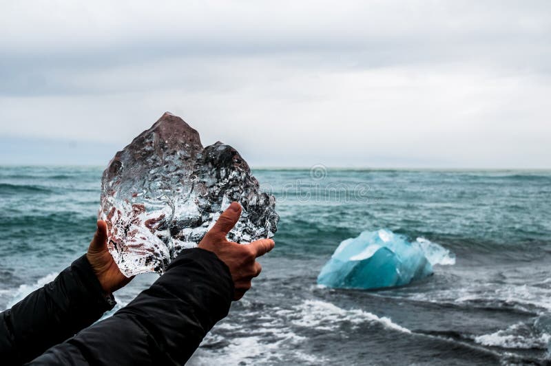 Hands Holding a Block of Pristine Glacier Ice Stock Photo - Image of ...