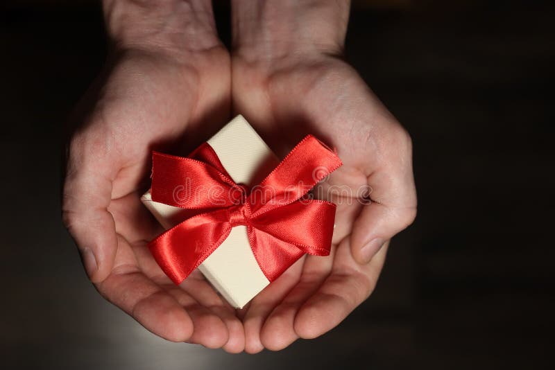 Hands holding a box. stock image. Image of horizontal - 176414889