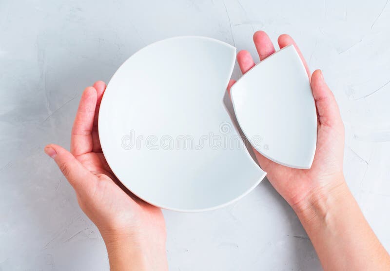 Broken White Bowl in Hands on a Concrete Table Stock Photo - Image of ...