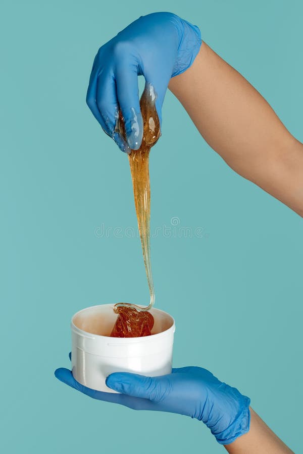 Hands Holding Bucket with Sugaring Paste for Depilation Procedure Over ...