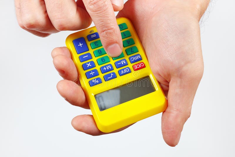 Hands Calculate Using a Pocket Calculator Over Workplace of the ...
