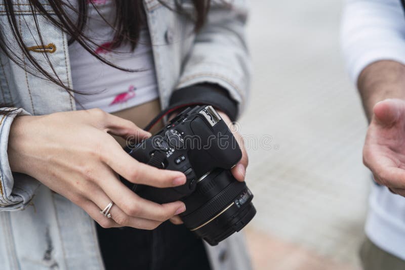 Hands holding a camera stock photo. Image of photographer - 217716356