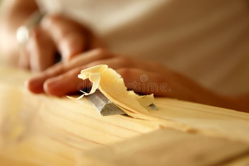 Hands Holding a Chisel and Working on Wood. Close-up of Carpenters ...