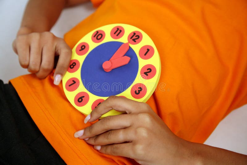 Hands Holding a Colorful Clock Stock Image - Image of colorful, morning ...
