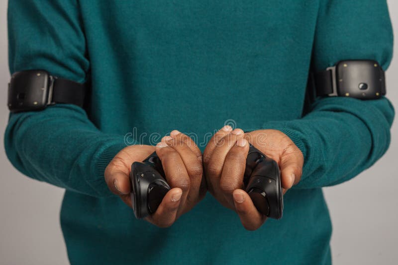 Hands Holding Controllers from Virtual Reality Headset. VR Technology ...