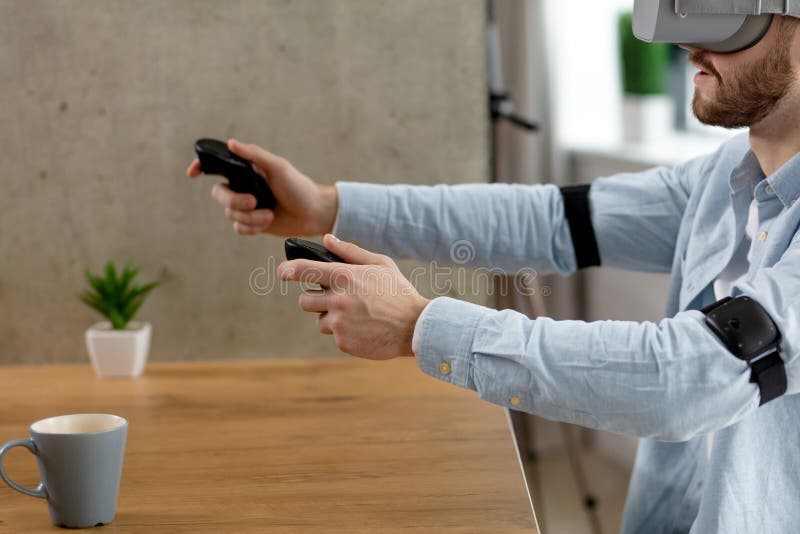 Hands Holding Controllers from Virtual Reality Headset. VR Technology ...
