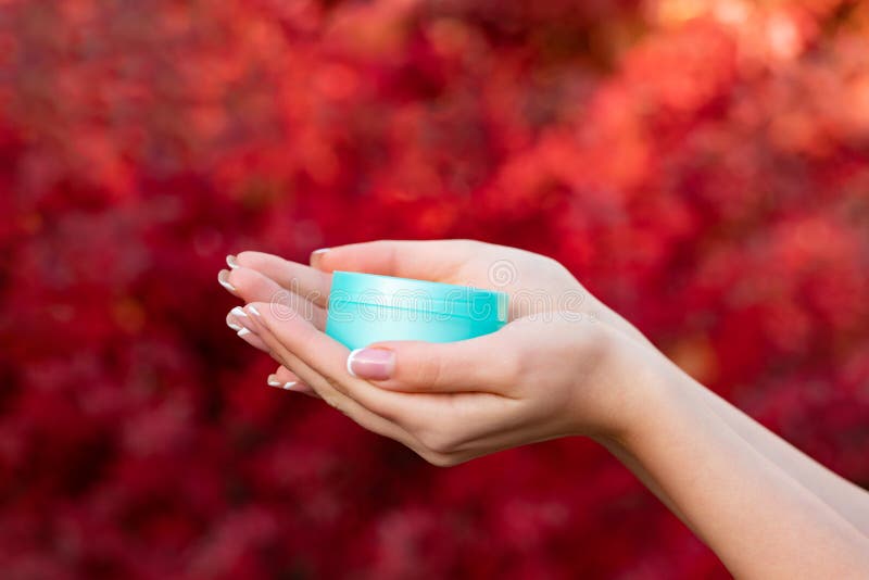 Hands Holding Cream Jar for Skincare. Hand Cream Stock Image - Image of ...