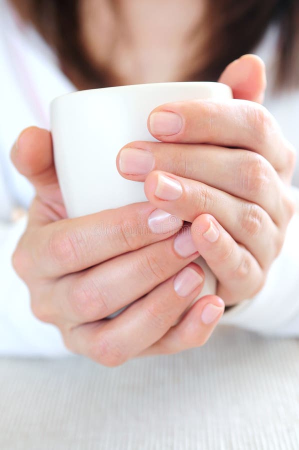Hands holding a cup stock image. Image of drinking, herbal - 4980631