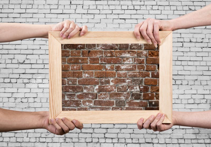 Hands holding frames stock photo. Image of close, brick - 41112860