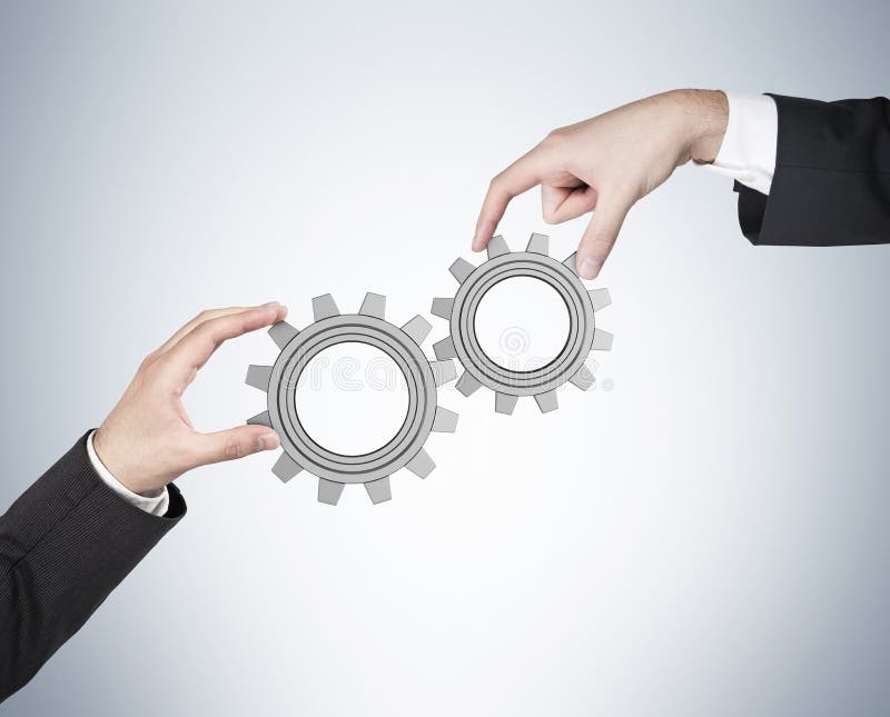 Hands holding gears stock image. Image of engineering - 48505241