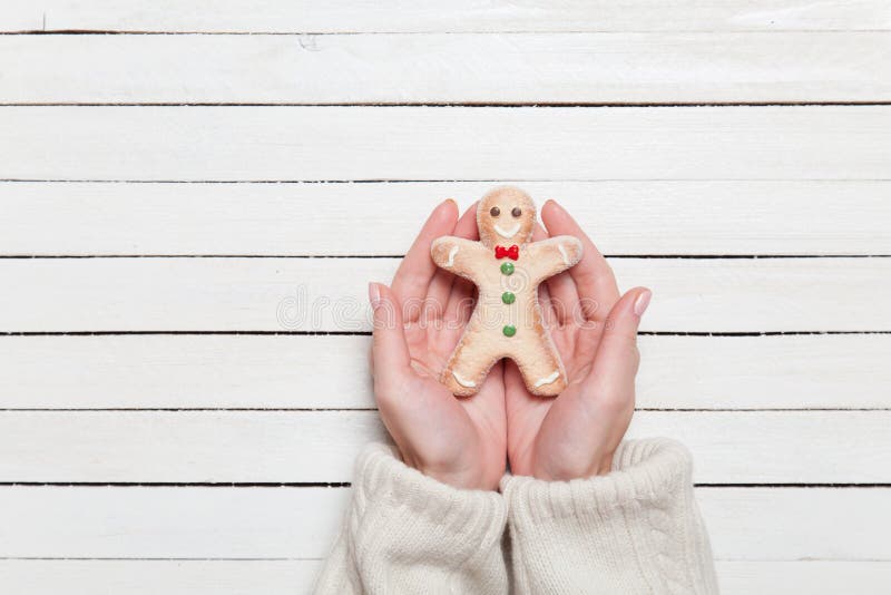 Hands holding gingerbread stock photo. Image of greeting - 46086116