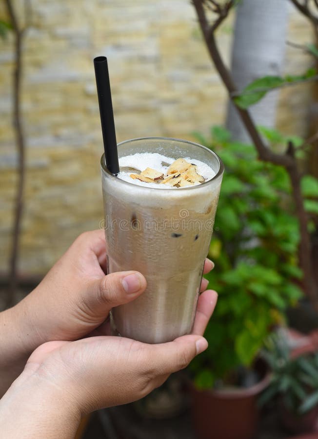 Hands Holding Glass with Coffee Milk Shake with Burnt Coconut Stock ...