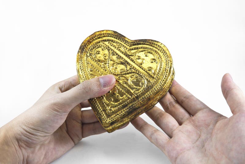 Hands holding golden heart stock image. Image of object - 23195047