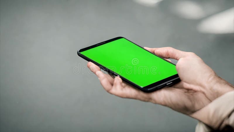 Hands Holding a Green Screen Smartphone Stock Footage - Video of ...