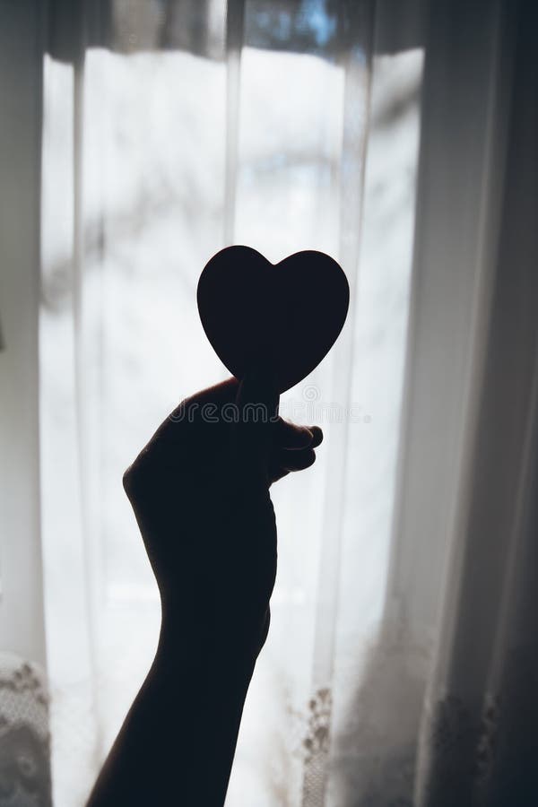 Hands Holding Heart Shape Against Window on a Sunny Day Stock Image ...