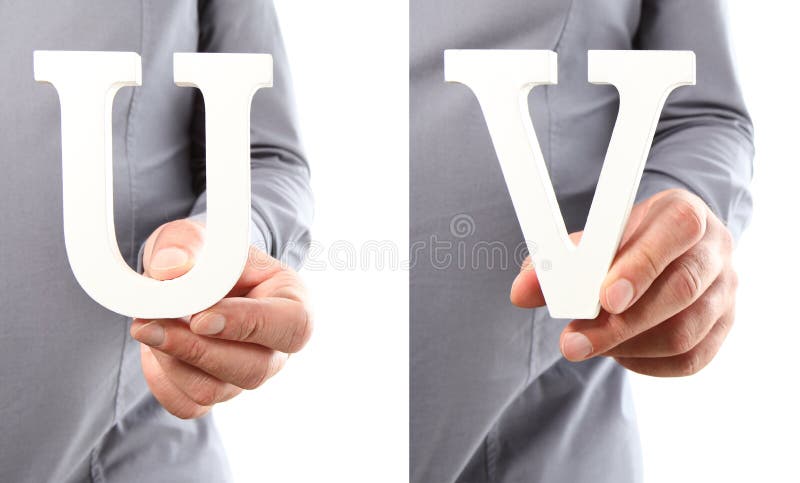 Hands Holding Letter U and V from Alphabet Isolated on a White B Stock ...