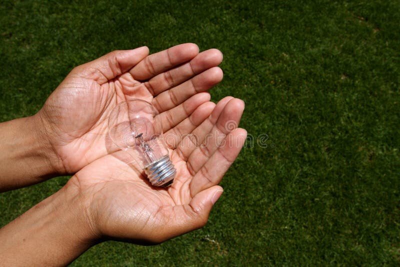Hands holding a light bulb stock photo. Image of fingers - 9205722