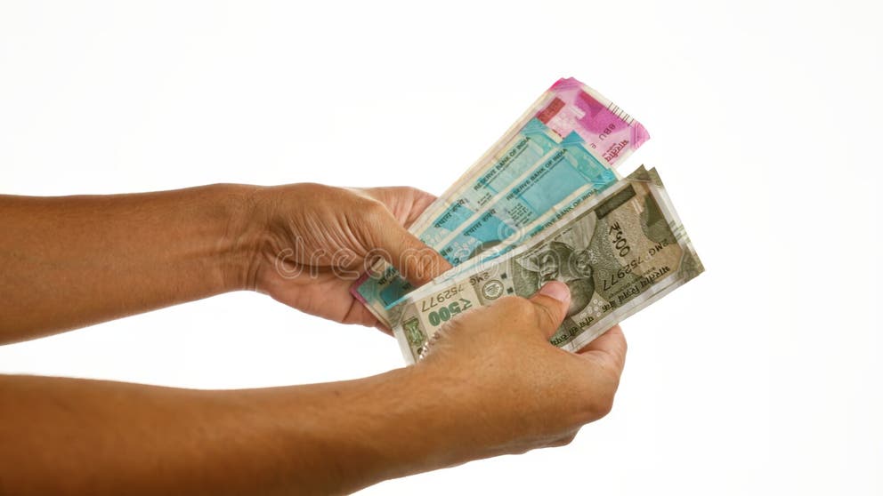 Hands Holding Multiple Indian Rupees on an Isolated White Background ...