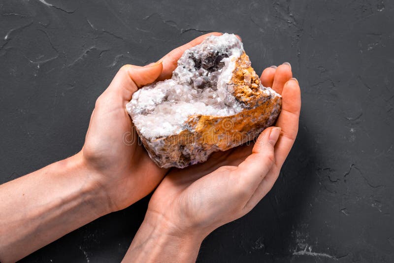 Hands Holding Natural Mineral Rock or Shiny Gemstone Stock Image ...