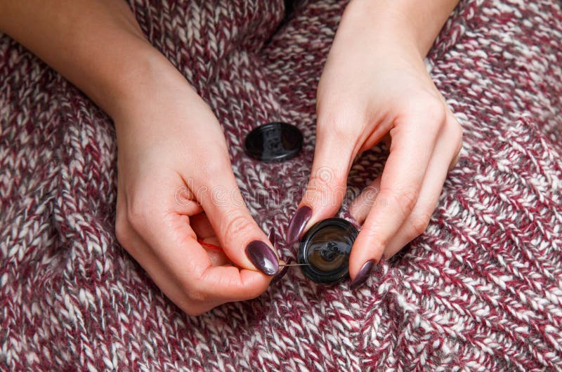 Hands Holding Needle and Button Stock Image - Image of pullover, violet ...
