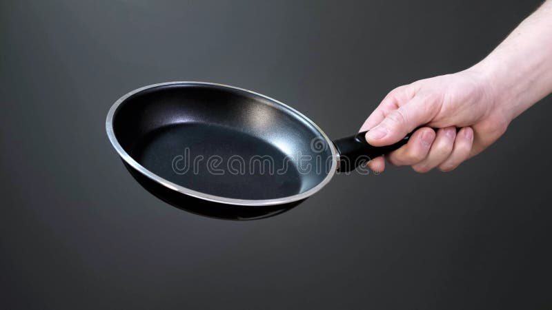 Hands Holding New Empty Black Frying Pan. Close Up. Stock Image - Image ...