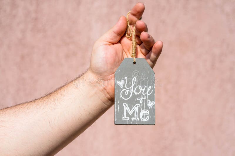 Hands Holding Ornament with Text Message You and Me Stock Image - Image ...