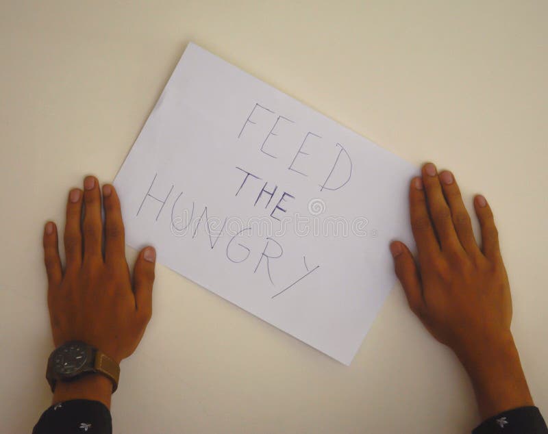 Hands Holding A Paper, Feed The Hungry Concept Stock Photo - Image of ...