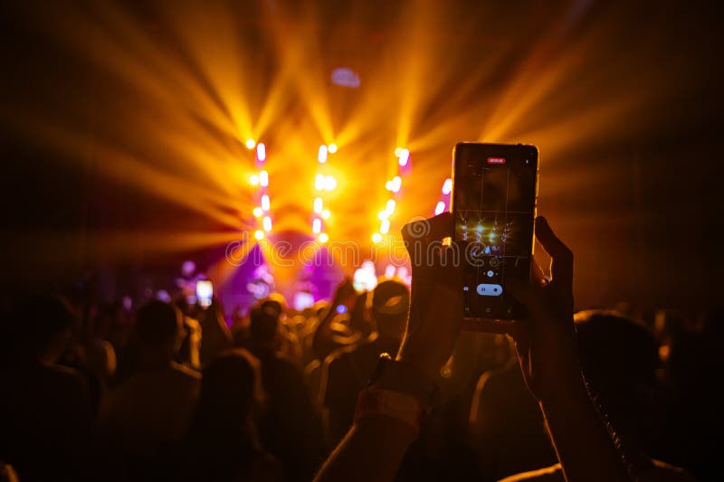 Hands Holding Phone and Making Photos on the Concert Stock Image ...