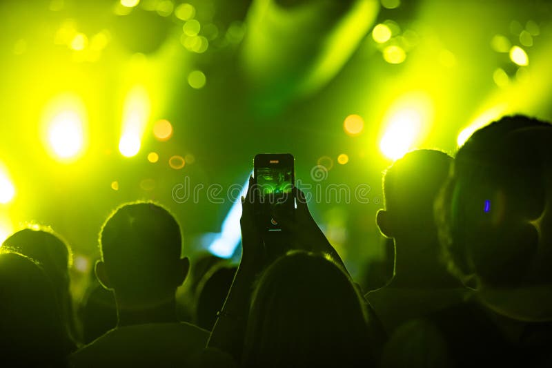Hands Holding Phone and Making Photos on the Concert Stock Image ...