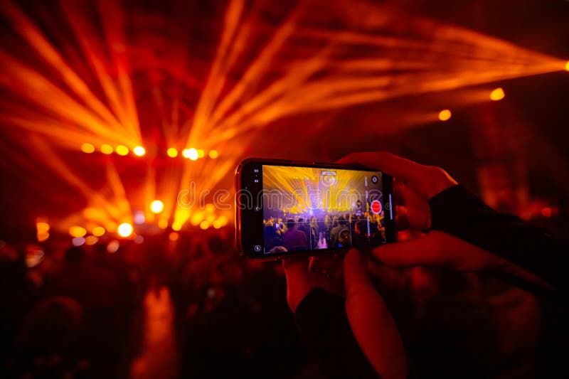 Hands Holding Phone and Making Photos on the Concert Stock Image ...