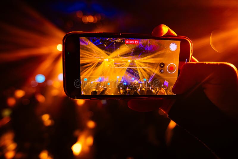 Hands Holding Phone and Making Photos on the Concert Stock Photo ...