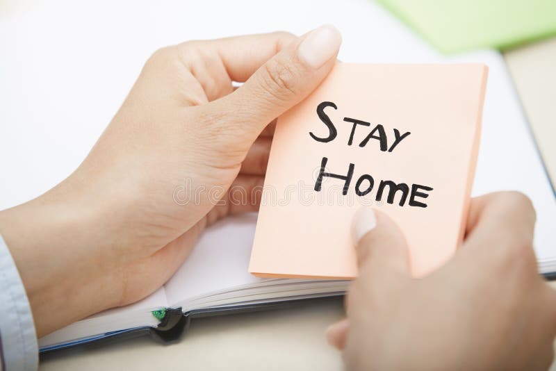 Hands Holding Pink Sticky Note with Stay Home Text Stock Image - Image ...