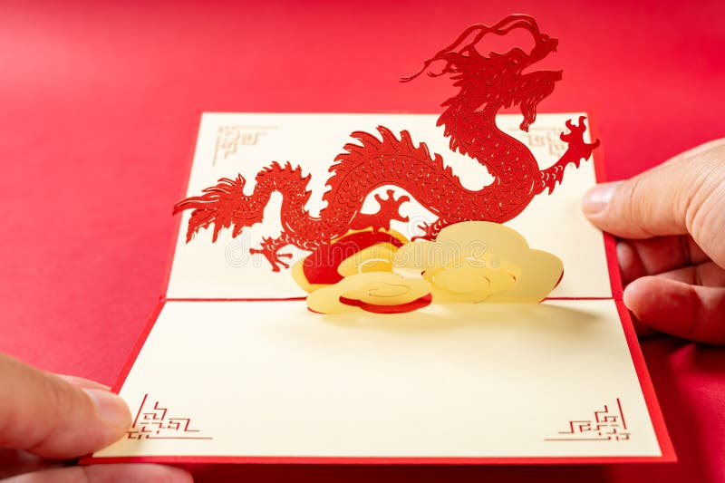 Hands Holding Pop-up Greeting Card with a Dragon Stock Photo - Image of ...