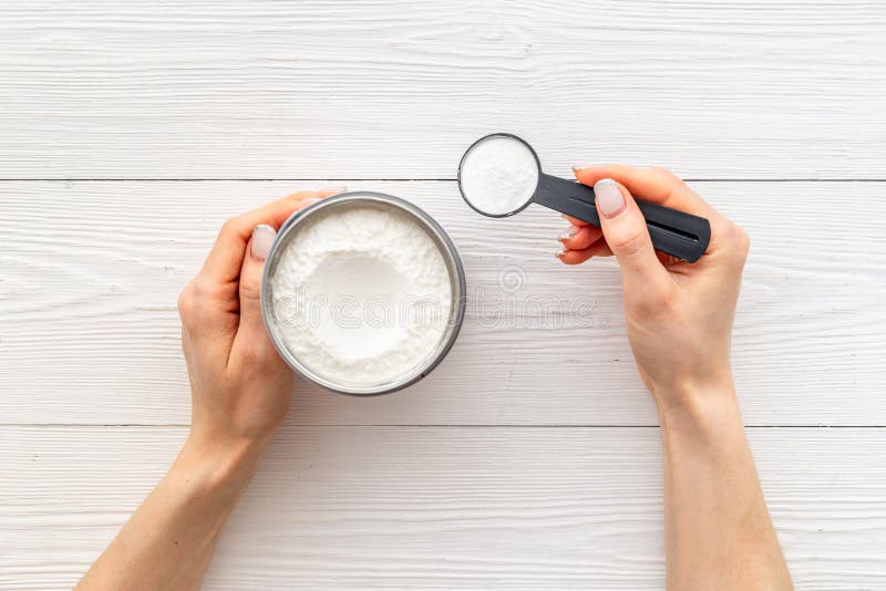 Hands Holding Protein Powder in Scoop. Sport Nutrition Stock Photo ...