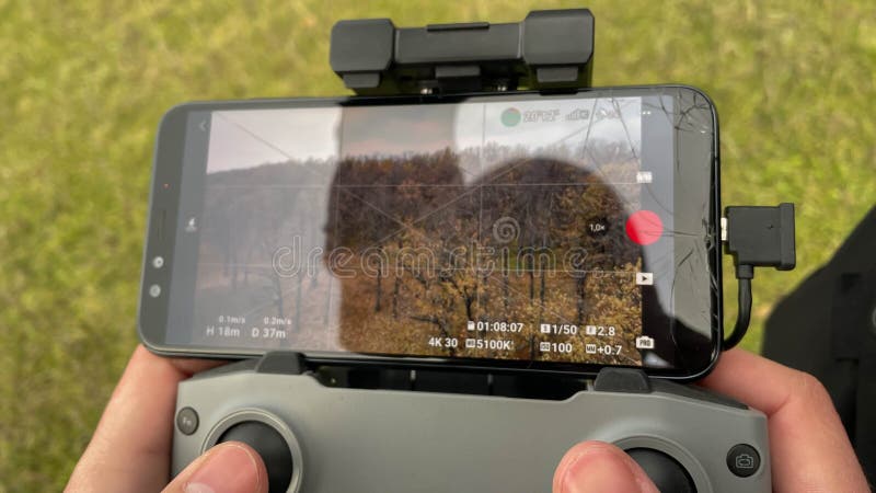 Hands Holding the Remote Control with the Phone from the Drone Stock ...