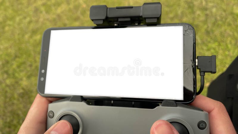 Hands Holding the Remote Control with the Phone from the Drone White ...