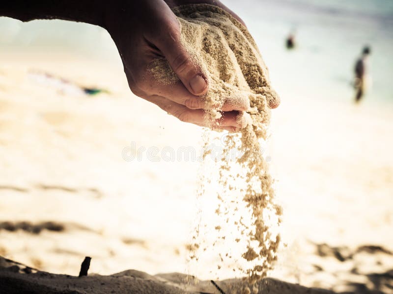 Woman with sand in hands stock image. Image of close - 20727719
