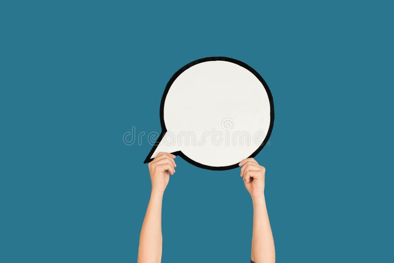 Hands Holding the Sign of Comment on Blue Studio Background Stock Image ...