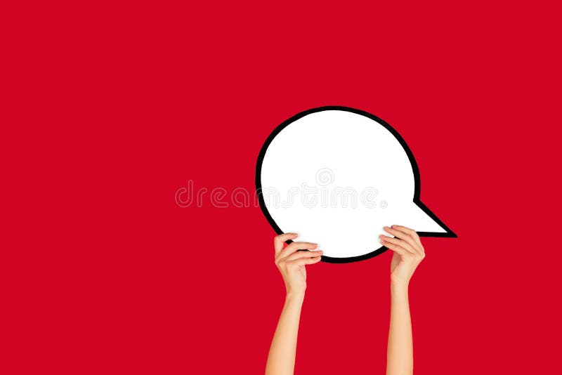 Hands Holding the Sign of Comment on Red Studio Background Stock Photo ...