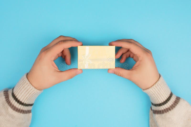 Hands Holding a Small Box with a Gift. Stock Photo - Image of office ...