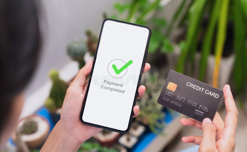 Hands Holding Smartphone with Credit Card and Showing Payment Completed ...