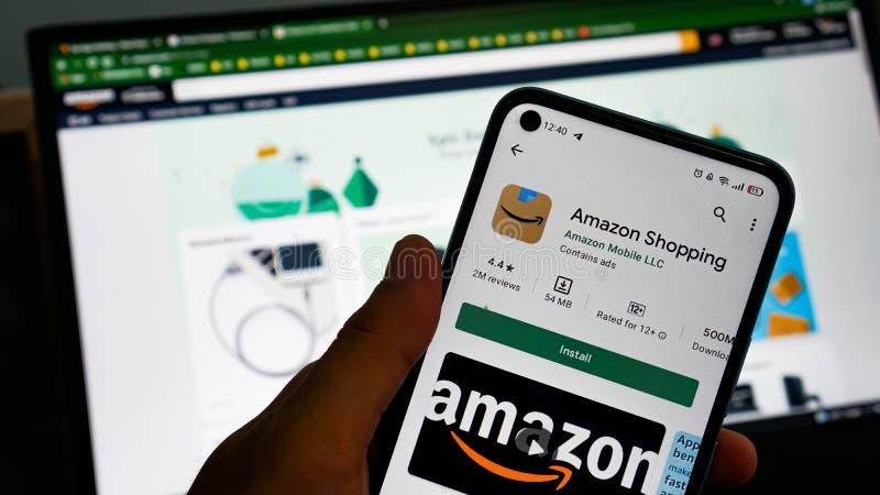 Hands are Holding Smartphones. Open the Amazon Application with the ...