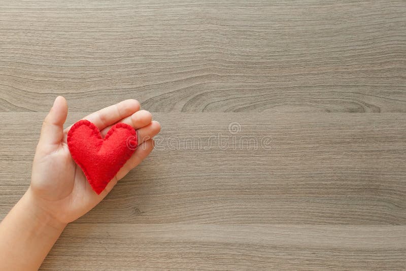 Hands Holding a Soft Heart Shape. Valentine`s Day Stock Photo - Image ...
