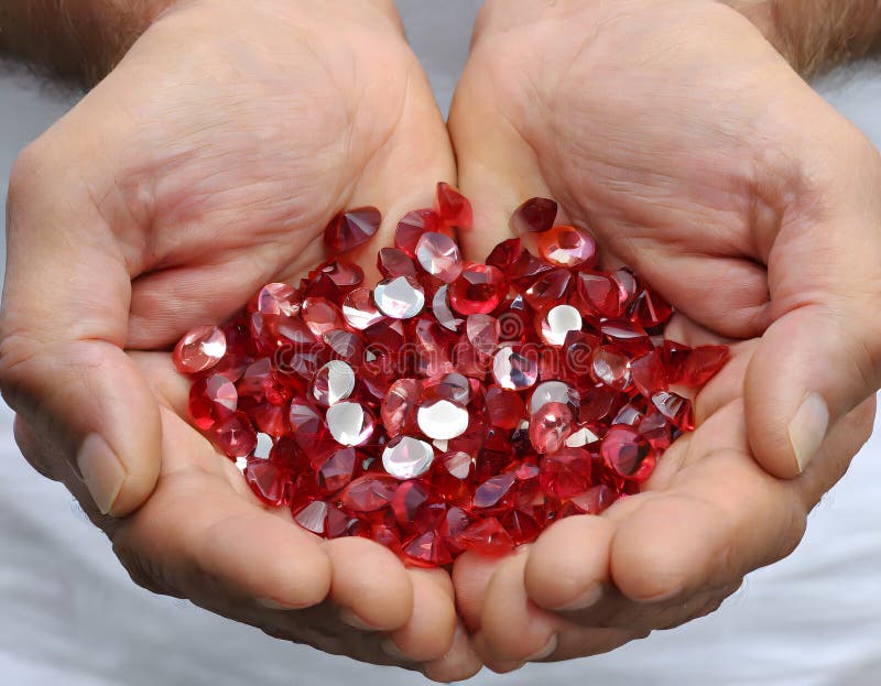 Hands Holding Sparkling Rubies Stock Photo - Image of valuables ...