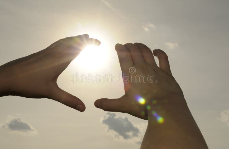Hands holding the sun stock photo. Image of energy, back - 19166436