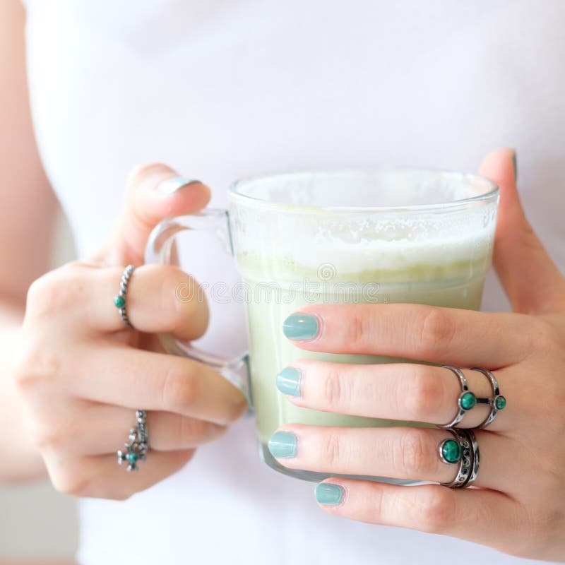 Hands Holding Tea Cup on Green Tea Stock Photo - Image of beverage ...