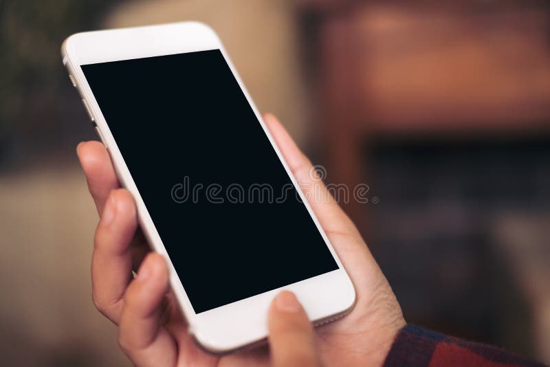 Hands Holding and Using White Mobile Phone with Blank Black Screen in ...