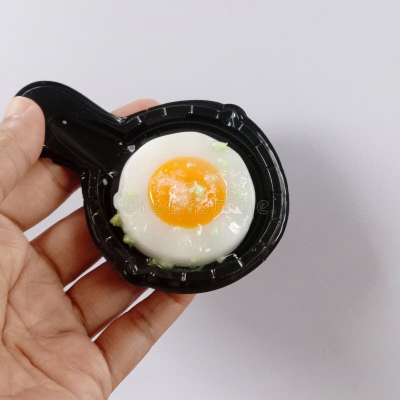 Hands Holding a Very Cute Fried Egg Shaped Milk Pudding Stock Photo - Image of cuisine, food ...