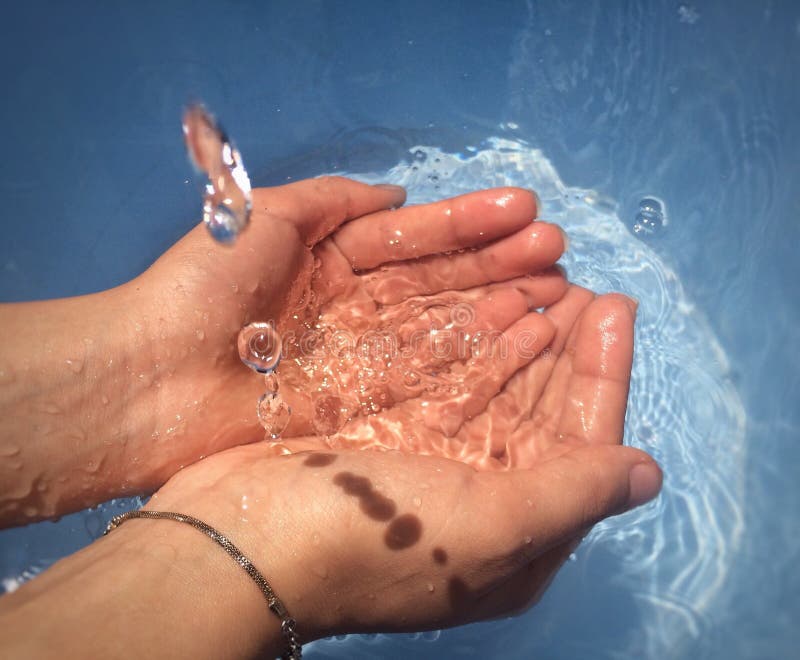 Hands holding water stock photo. Image of firm, falling - 53707880